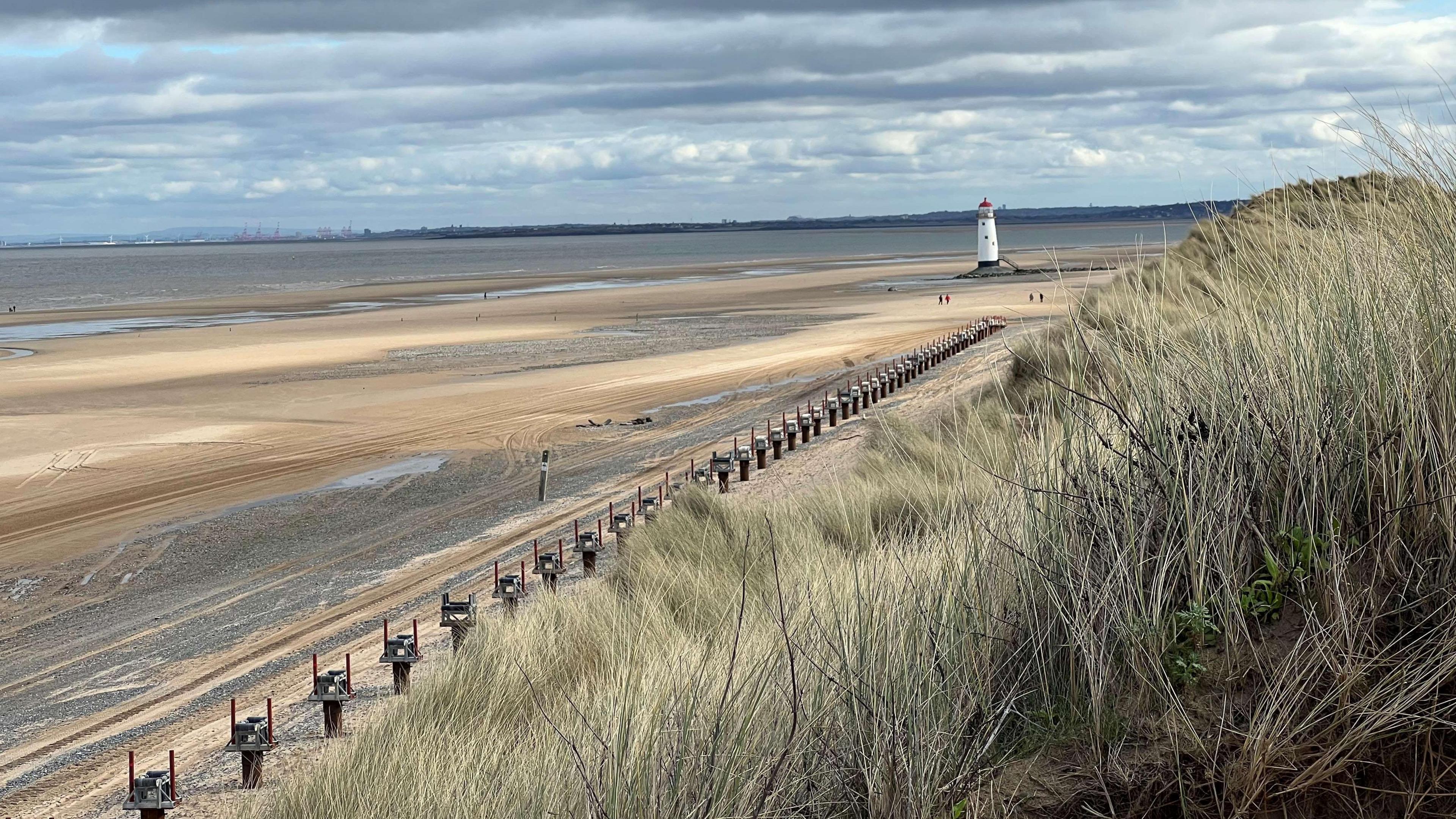 Talacre beach giant pipe across sand shocks visitors - BBC News