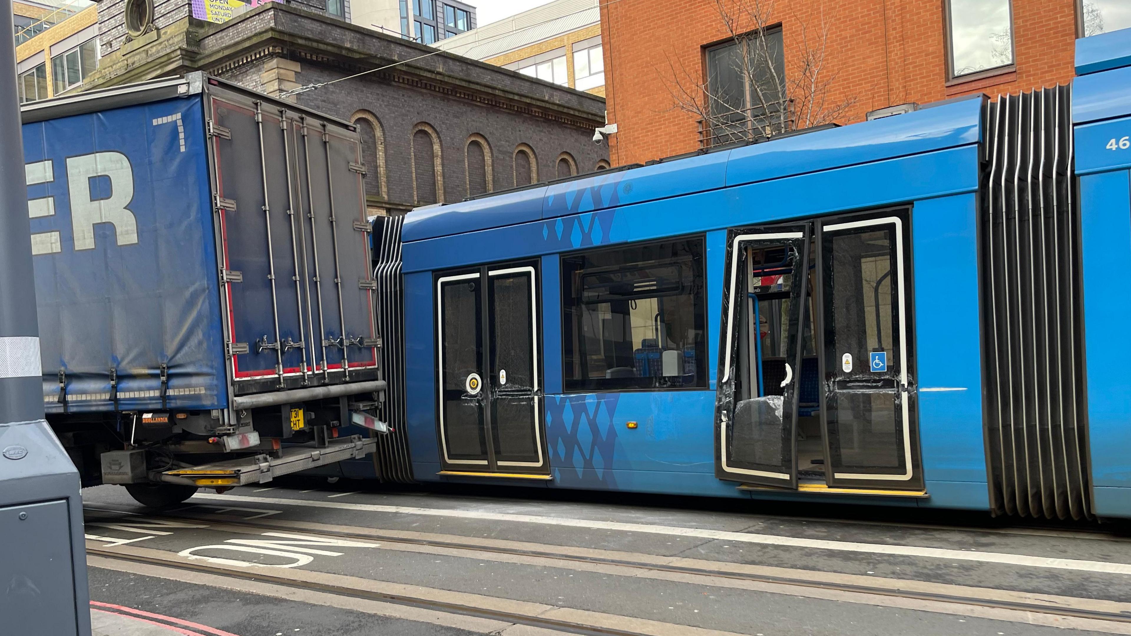 Birmingham tram and lorry collision disrupts rush hour - BBC News