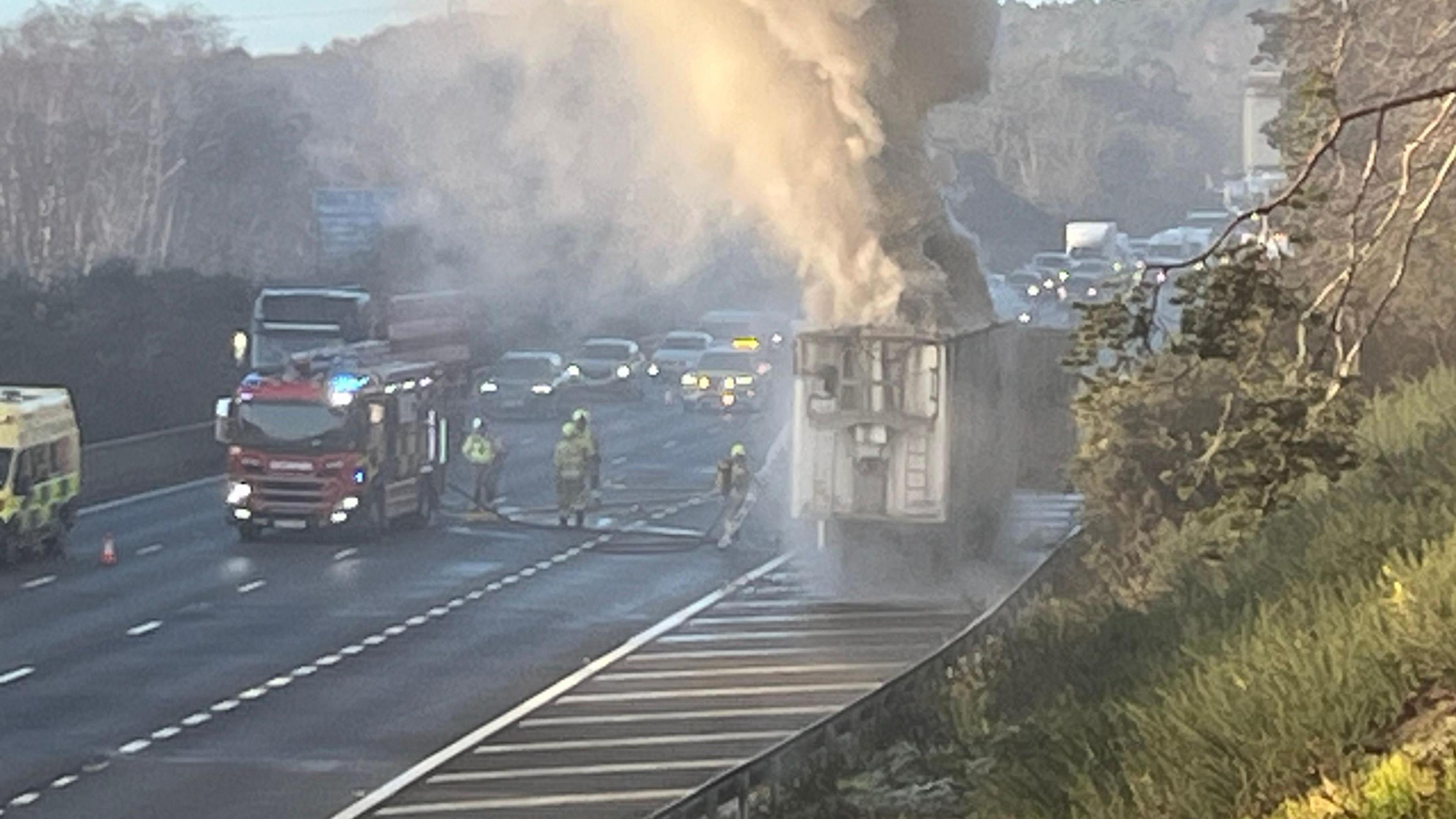 M3 closed northbound after electrical waste fire in lorry trailer - BBC ...