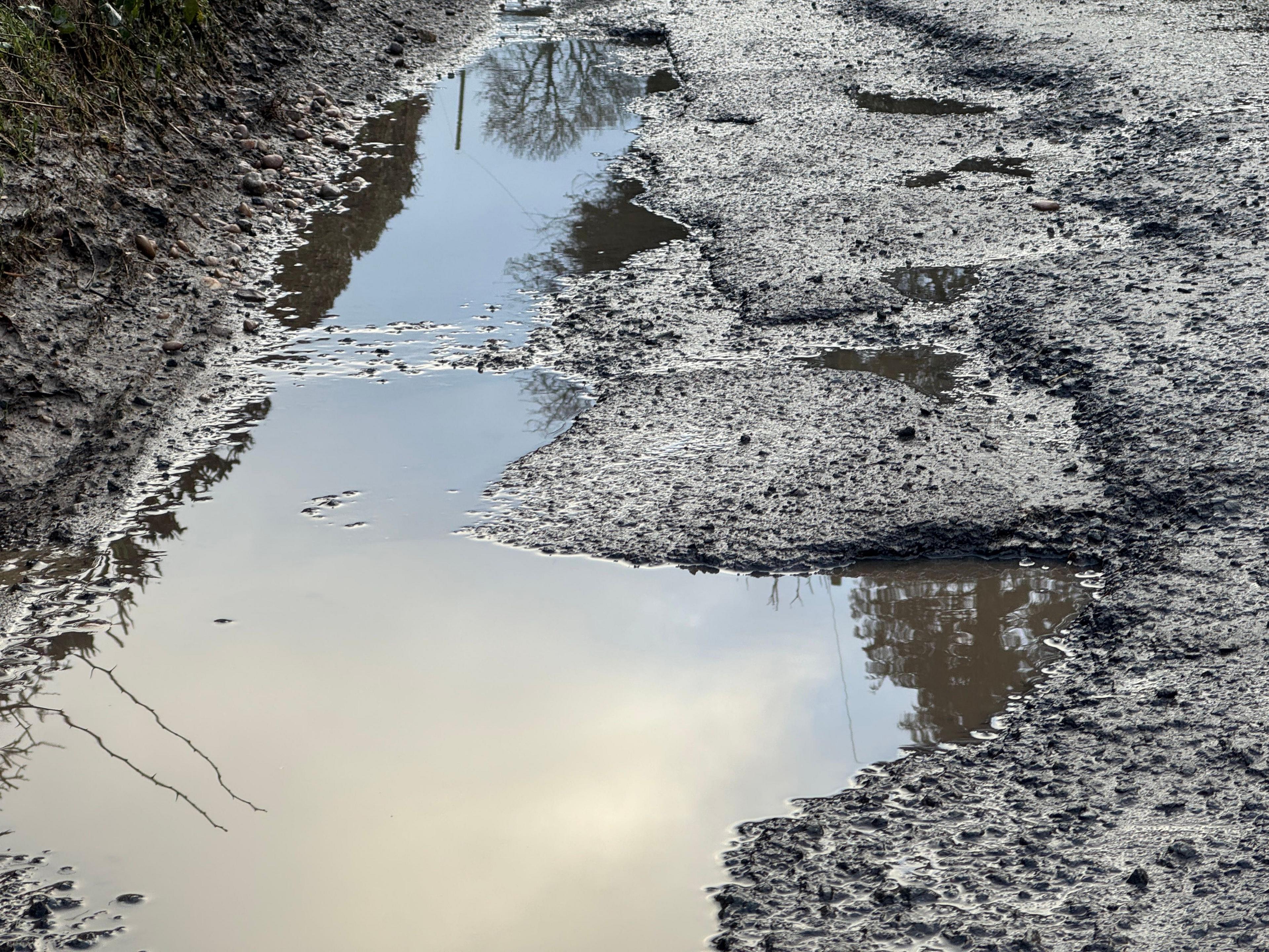 Residents want permanent fix on pothole-hit road in Derbyshire - BBC News