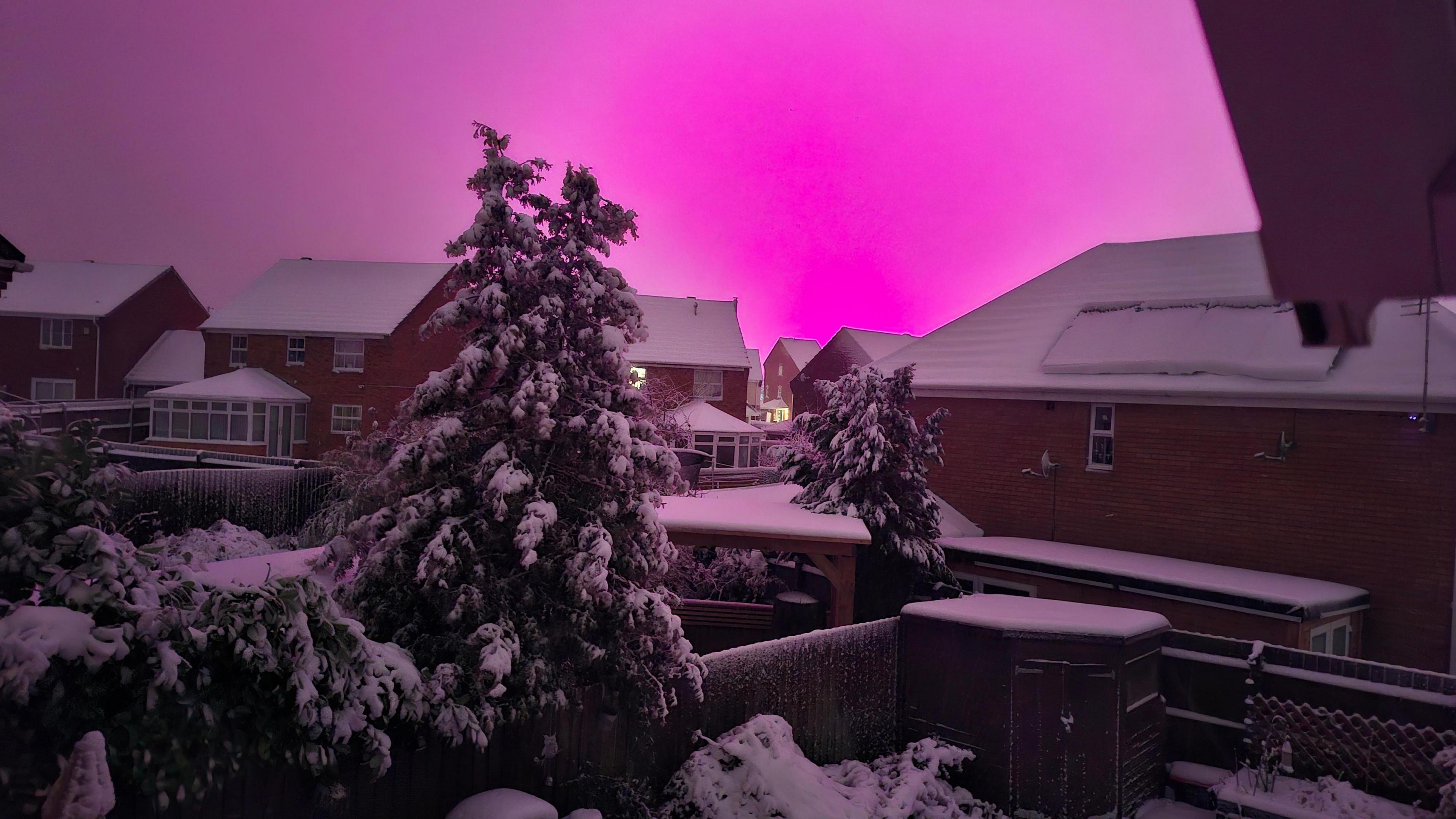Dazzling pink sky seen over Birmingham in Storm Goretti snowfall - BBC News