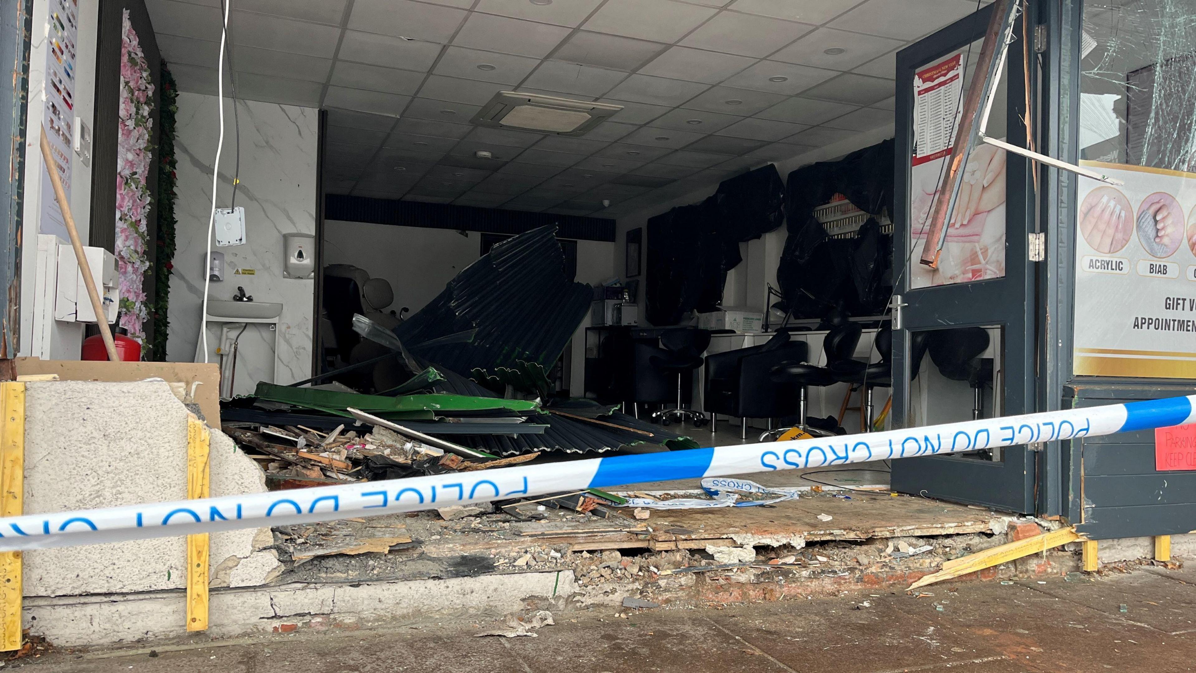 Nottingham nail bar damaged after car crashes into building - BBC News
