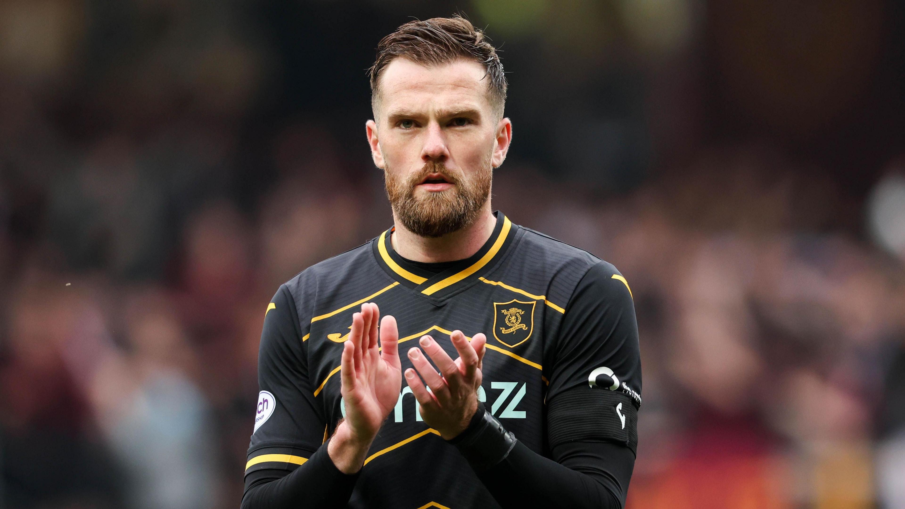 Michael Devlin says he will honour Livingston contract - BBC Sport