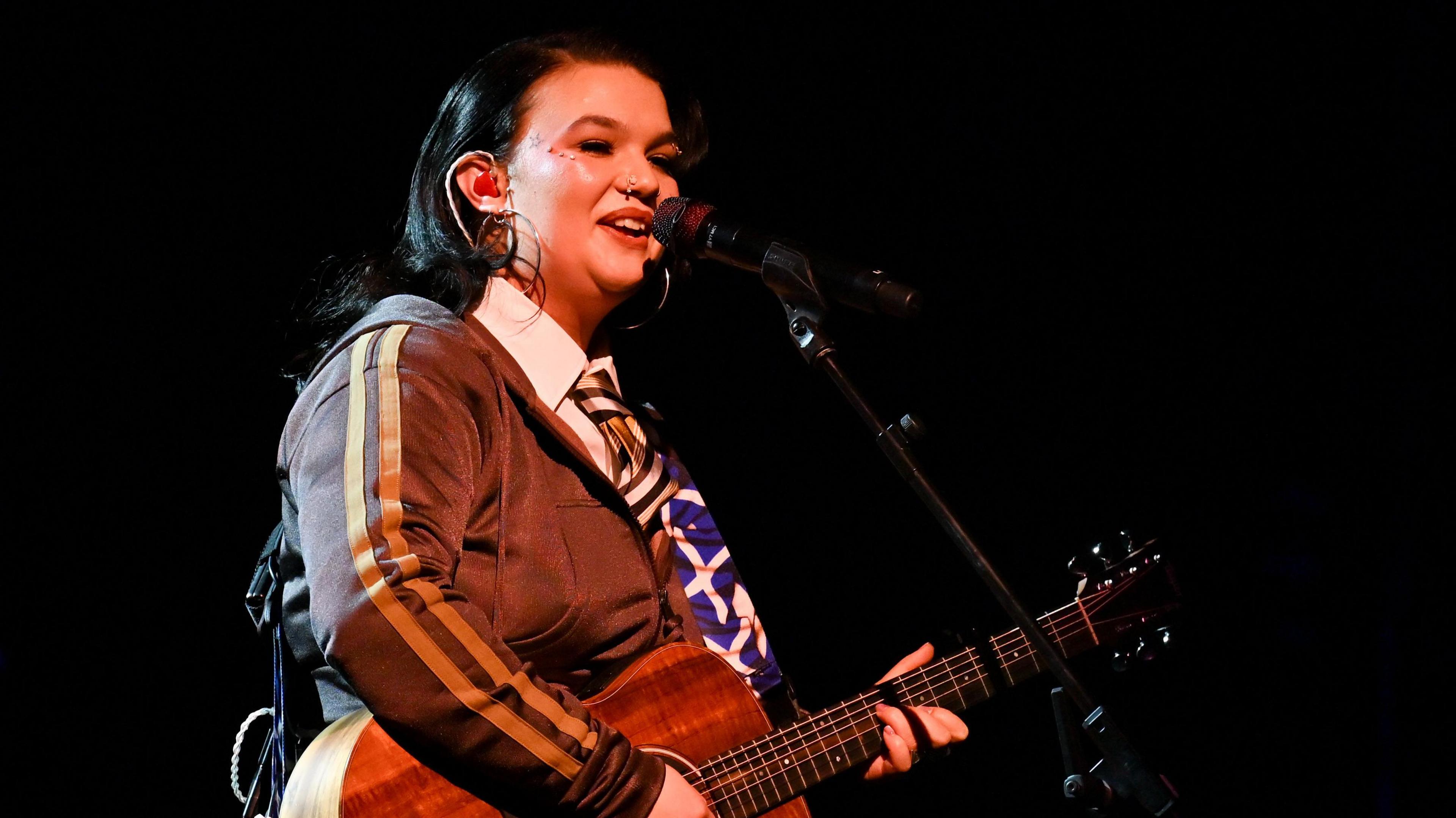 Lola Young: Messy singer back on stage and on form at London Palladium ...