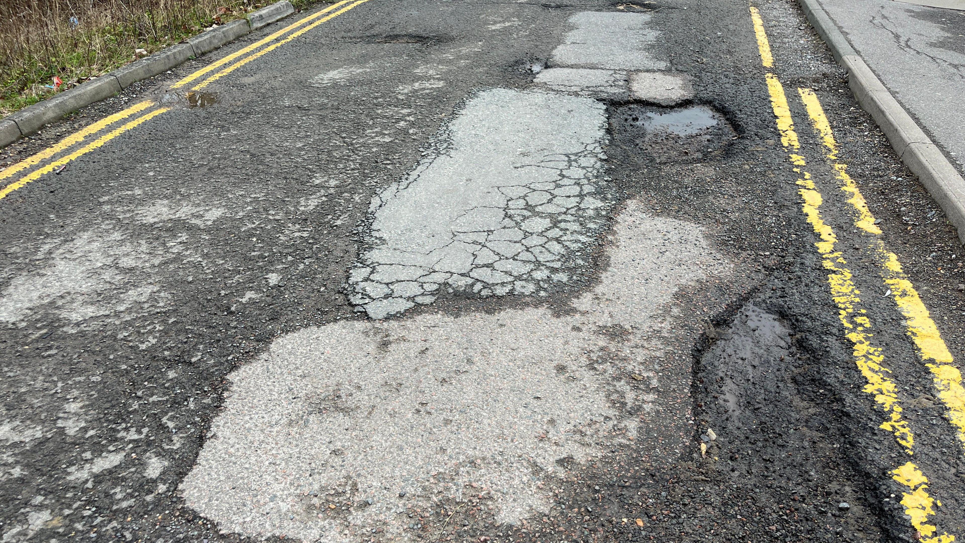 Potholes 'dangerous' for Surrey and Sussex cyclists and motorcyclists ...