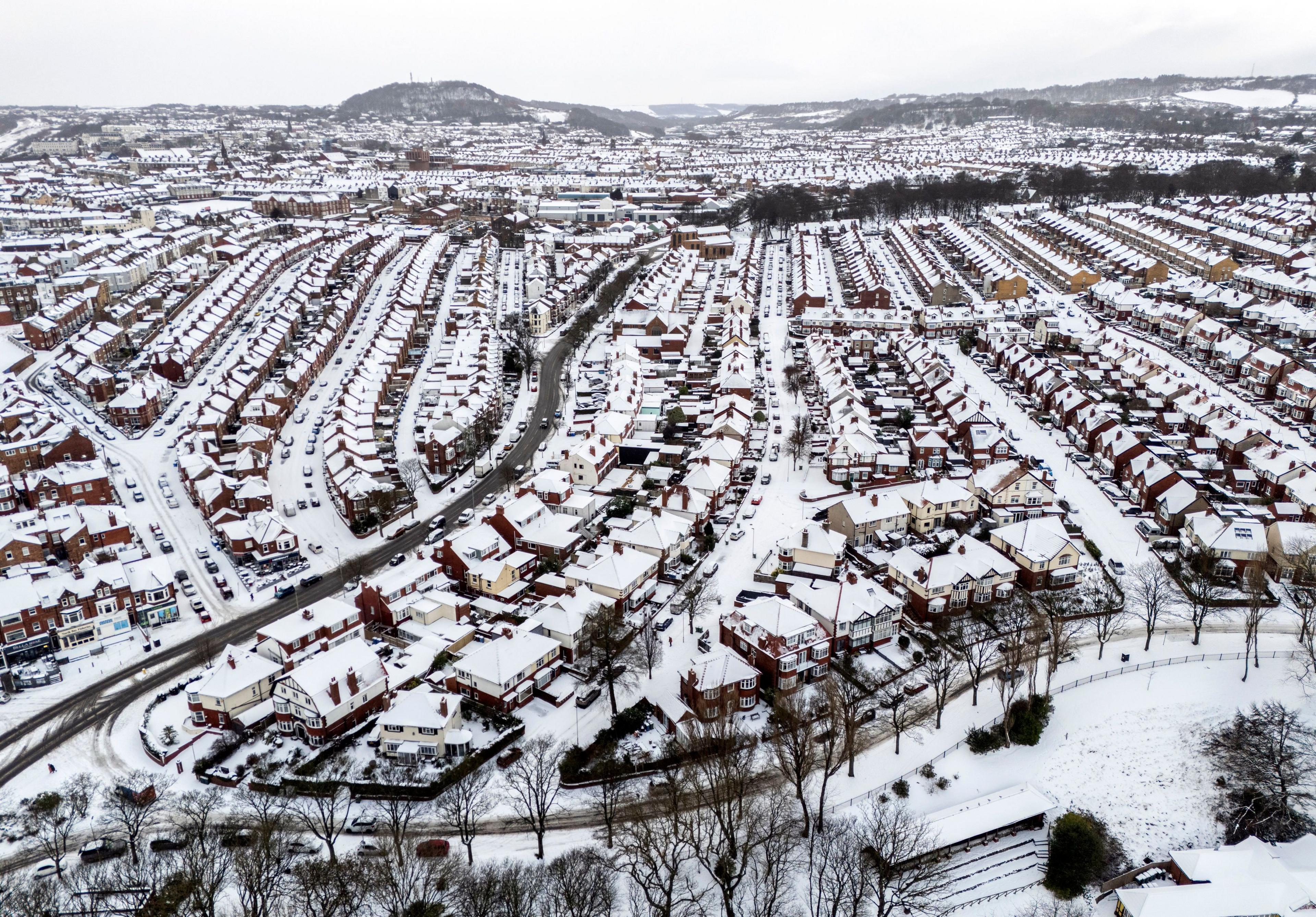 Snow and ice hit UK road and rail travel with schools forced to shut ...