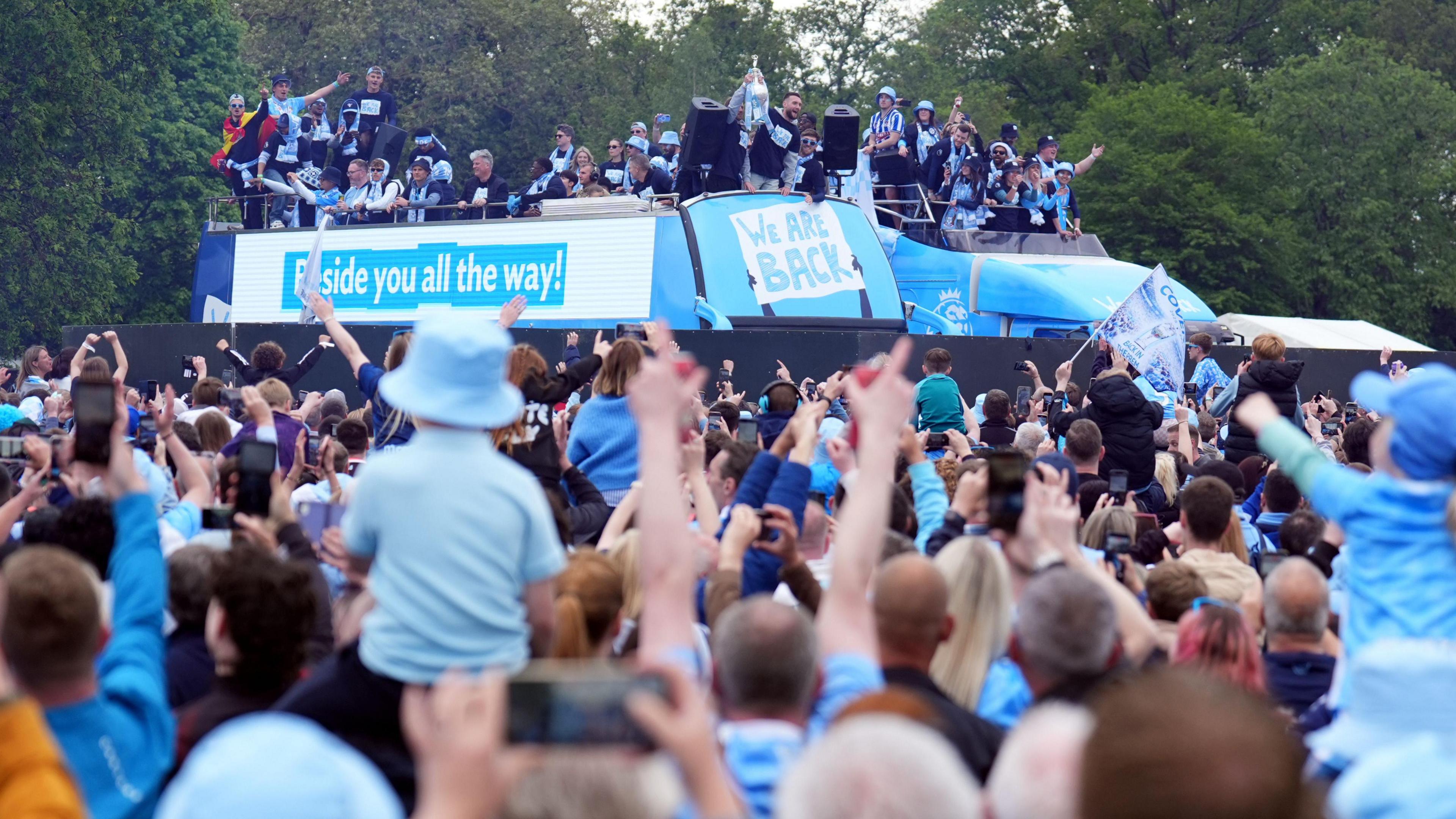 Coventry City fans party as Sky Blues enjoy promotion bus parade - BBC News