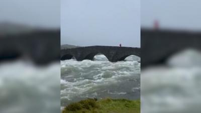 High waters sweep through bridge on Skye after heavy rainfall - BBC News