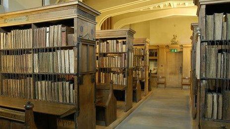 Medieval library with chained books gets annual clean - BBC News