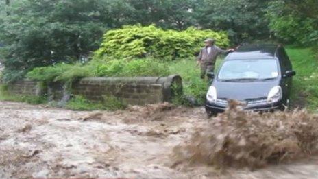 Flood warning after showers in Mytholmroyd and Hebden Bridge - BBC News