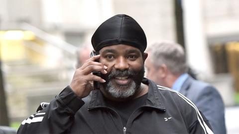 Brian McIntyre: Boxing trainer who brought gun to UK sentenced - BBC News