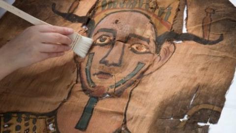 Mummy shroud found after 80 years in museum collection - BBC News