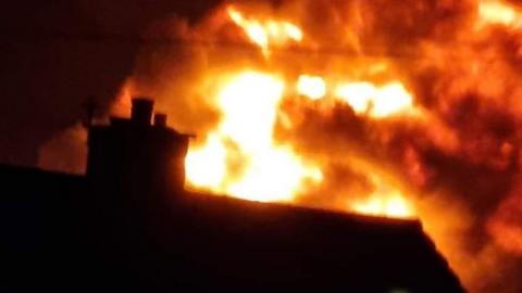 Distington residents evacuated as fire hits industrial yard - BBC News
