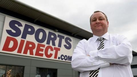 Sports Direct profits more than halve - BBC News