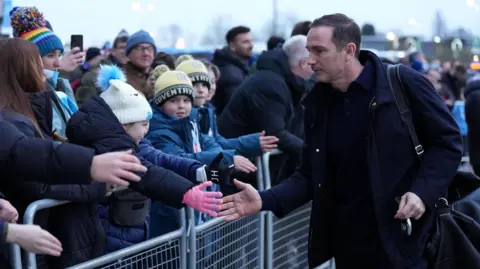 Coventry boss Frank Lampard greets young fans as he arrives at the CBS Arena