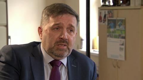 With Robin Swann stepping down, what next for NI health service? - BBC News