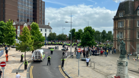 Police disperse Stoke-on-Trent protesters after missiles hurled - BBC News