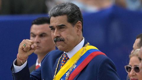 Nicolas Maduro pumps his fist during Independence Day celebrations 