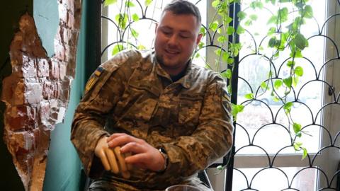 Exhausted Ukraine struggles to find new men for front line - BBC News