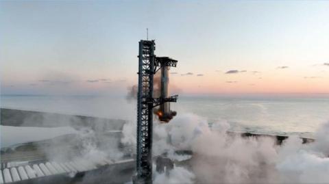 Space X: Rocket booster caught in mid-air for the first time - BBC ...