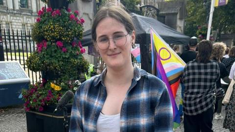 Protests held as puberty blockers ban extended to NI - BBC News