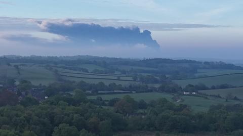 Large Cannock parcel centre fire causes huge smoke plume - BBC News