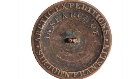 Rare arctic rescue button makes £6000 at auction - BBC News