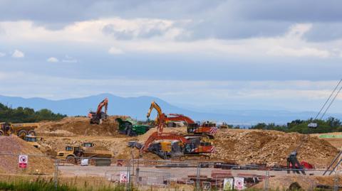A417 Missing Link: Aerial pictures show progress - BBC News