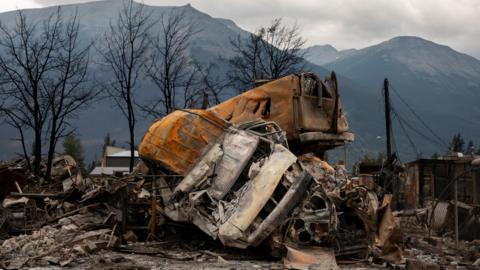 Jasper fire: Images show destruction from wildfire in Canada - BBC News