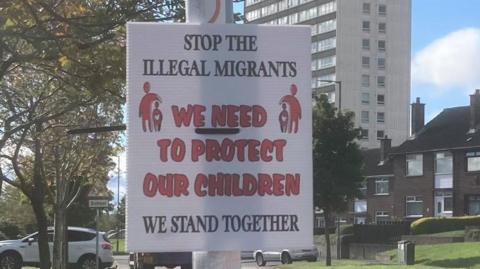Anti-immigration posters removed from Rathcoole - BBC News