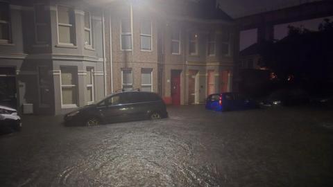 Clean-up under way after flooding hits South West - BBC News