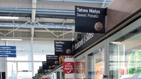 Welsh language signs spotted in Helston Tesco in Cornwall - BBC News