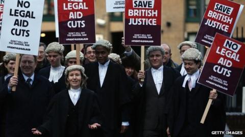 Lawyers protesting outside courts over legal aid cuts - BBC News