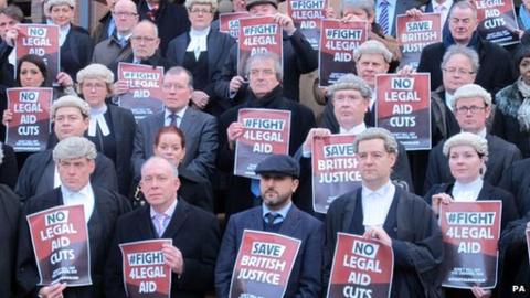 Lawyers protesting outside courts over legal aid cuts - BBC News