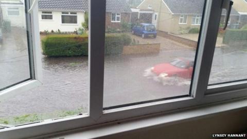 Heavy rain causes flash flooding in Norwich - BBC News