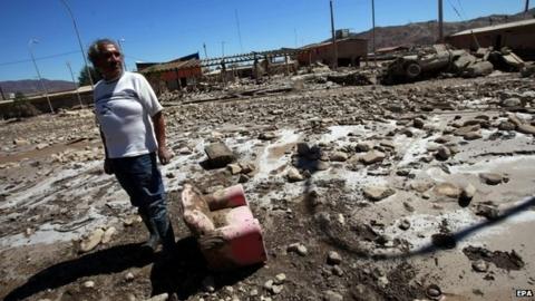 Chile floods death toll rises to 17 as clean-up begins - BBC News