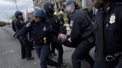 Baltimore riots: Troops deployed as cleanup begins - BBC News