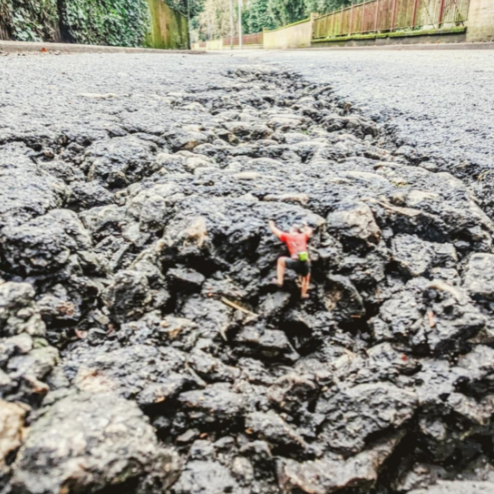 Man turns Newark potholes into tiny climbing scenes - BBC News