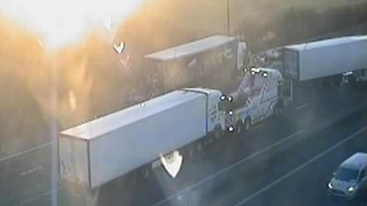 M25 shut between A12 and M11 junctions after three-lorry crash - BBC News