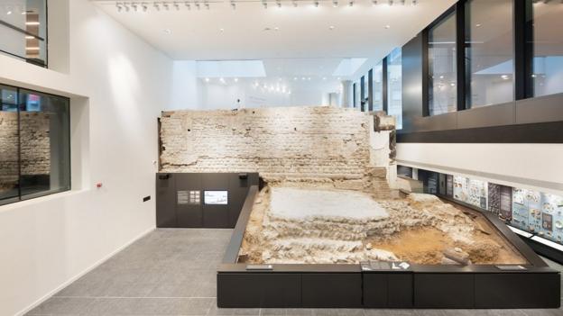 London Roman wall on display after 40 years hidden in basement - BBC News