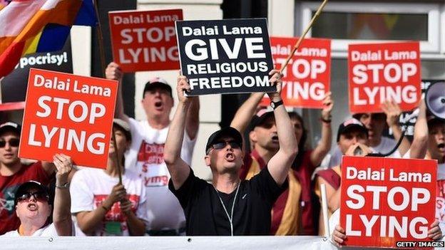Dalai Lama defies protesters to open Aldershot Buddhist centre - BBC News