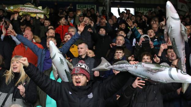 Ban on Grimsby Town fans' 'Harry Haddock' mascots reversed - BBC News