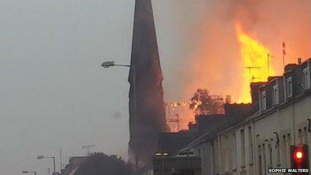 Homes evacuated as crews tackle Llanelli church fire - BBC News