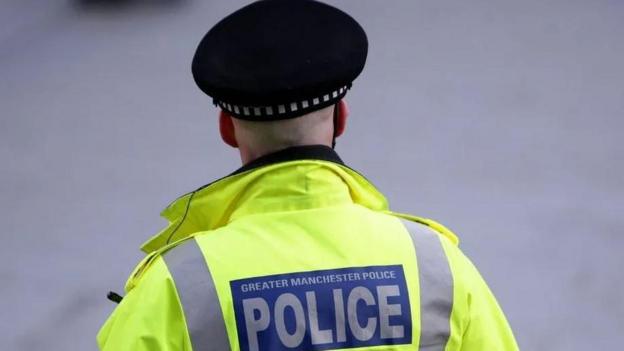 Three held after police attacked at Manchester Airport - BBC News