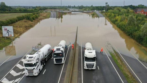 Heavy rain causes flash floods across the West Midlands - BBC News