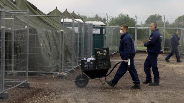 Migrant crisis: People treated 'like animals' in Hungary camp - BBC News