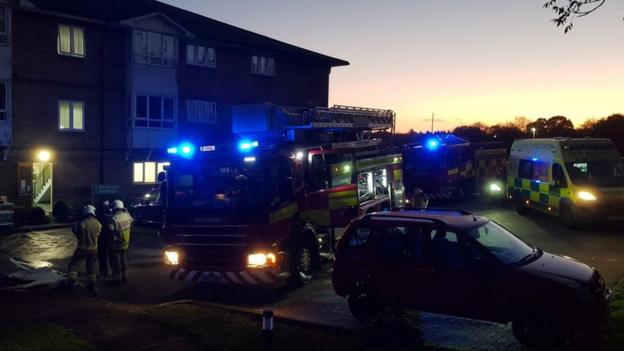 Serious flood forces evacuation of sheltered flats in Corby - BBC News