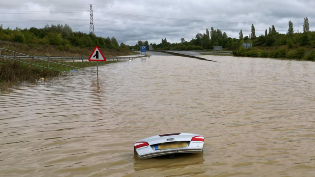 Flash floods and heavy rain batter England and Wales - BBC News