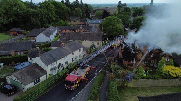 Swynnerton thatched roof fire caused by lorry hitting cables - BBC News