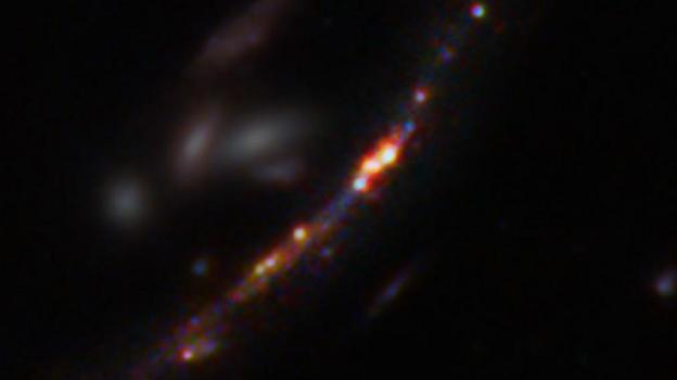 Firefly Sparkle: 'Christmas' galaxy reveals how Universe formed - BBC News